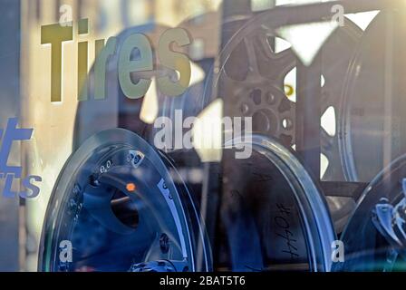 Steel alloy tire rims on display in a store window Stock Photo - Alamy