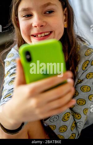 In this photo illustration a family video calling on FaceTime over a ...