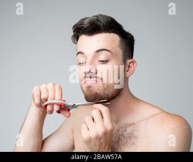 caucasian barber man haircutting hairstyle isolated on grey background ...