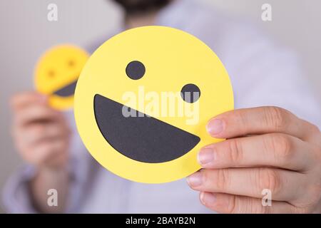 A Gold Smiley Leadership Concept in hand Stock Photo - Alamy