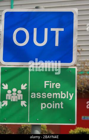 Assembly point signpost Stock Photo - Alamy