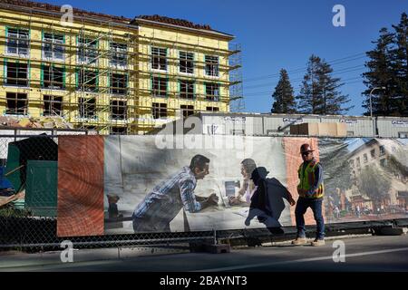 A worker walks at a construction site on a highway in Frankfurt ...