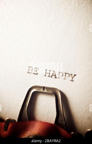The sentence, Be Happy, written with a typewriter Stock Photo - Alamy