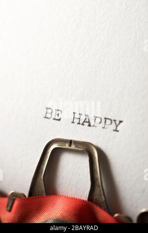 The sentence, Be Happy, written with a typewriter Stock Photo - Alamy
