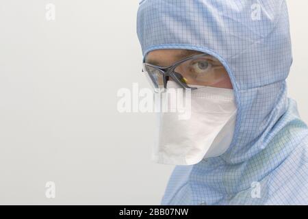 Man wearing gas mask lab protective gear respirator goggles eye ...