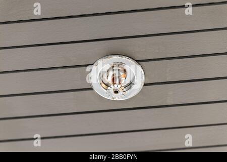 Image of pendent fire sprinkler in acoustic wooden ceiling texture ...