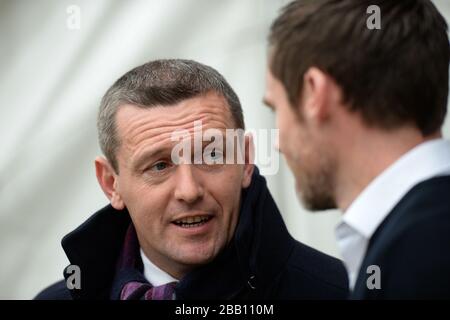 Northampton Town's Aidy Boothroyd talking to Fleetwood Town's manager ...