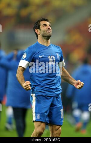 Greece's Georgios Karagounis celebrates victory and qualification for ...