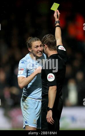 Leeds United's Luke Ayling is shown a yellow card by referee Kevin ...