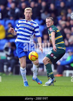 Reading's Pavel Pogrebnyak (left) & QPR's Benoit Assou-Ekotto challenge ...