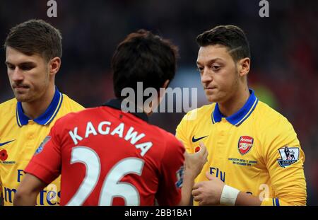 Shinji Kagawa of Manchester United and Aaron Ramsey of Arsenal during ...