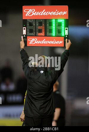 The fourth official holds up an electronic board signalling five ...