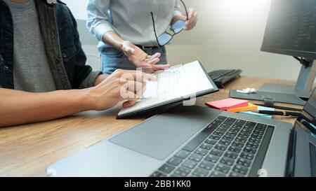 Team of programmers working together development Website design and coding technologies in a ...