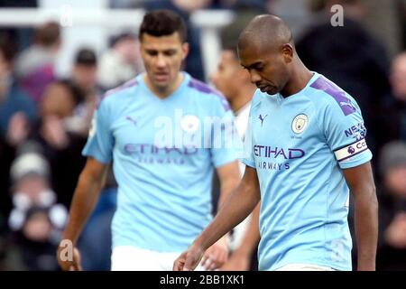 Manchester City's Fernandinho appears dejected as Wigan Athletic’s Max ...