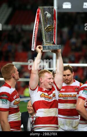 Wigan Warriors' Liam Farrell lifts the Super League Grand Final trophy ...