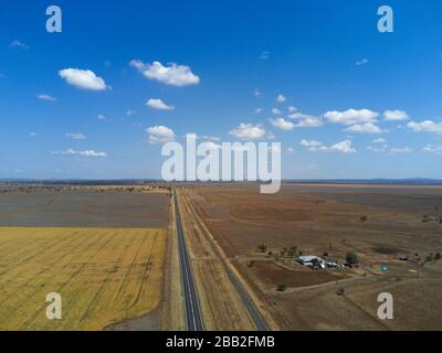 Aerial of Warrego Highway as it passes the Grain Silos at Wallumbilla ...