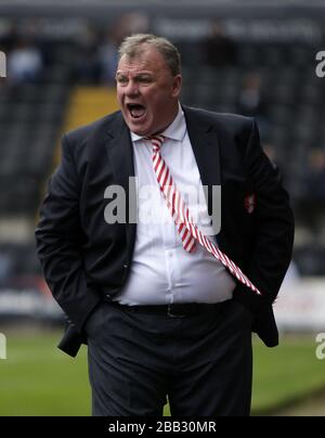 Rotherham United manager Steve Evans celebrates on the pitch after his ...