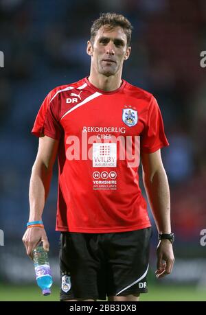 Huddersfield Town Head of Performance Darren Robinson (left) greets ...