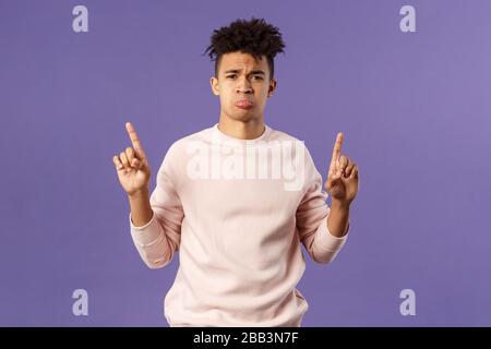 Portrait of gloomy, pouting frowning hipster guy dont have something he ...