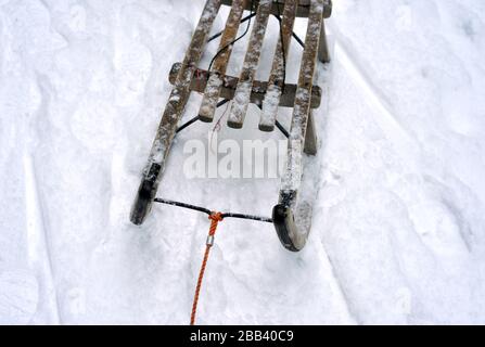 Old vintage wooden snow slider isolated on white background with ...