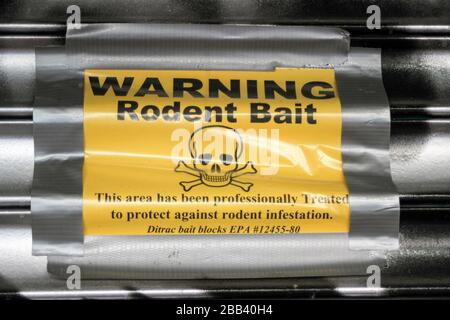 Warning sign on Poison bait trap to control predators on Kapiti Island ...