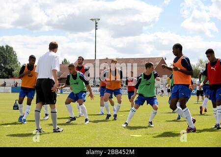 Coventry City assistant physiotherapist Sam Heathcote (centre) oversees ...
