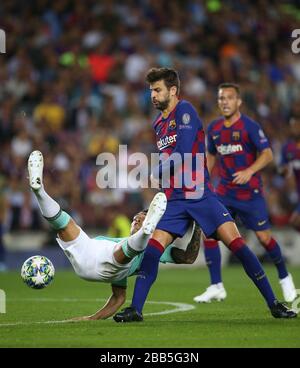 Inter Milan's Lautaro Martinez, right, is fouled by Barcelona's Pau ...