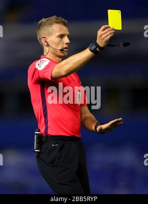 Referee Will Finnie shows Walsall's Cameron Pring the yellow card Stock ...