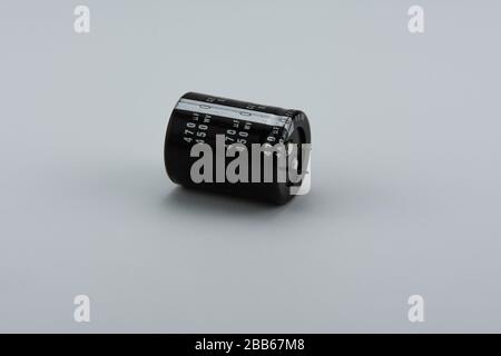 Electrolytic capacitor isolated on white background. High resolution ...