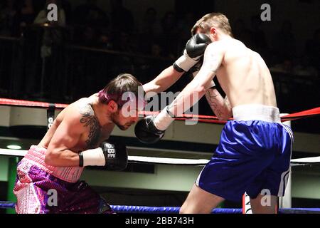 Phil Gill (purple shorts) defeats Damien Turner in a Light-Welterweight ...