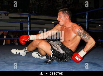 Tony Conquest (silver/black shorts) defeats John Anthony in a ...