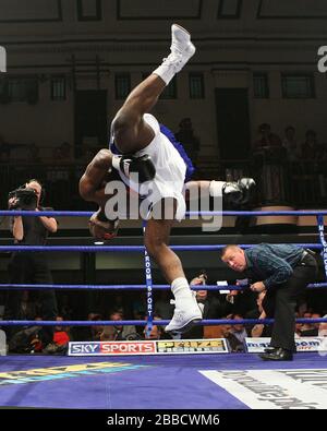 Round 1: Ted Bami (white shorts) defeats Andrew Ferrans (red shorts ...
