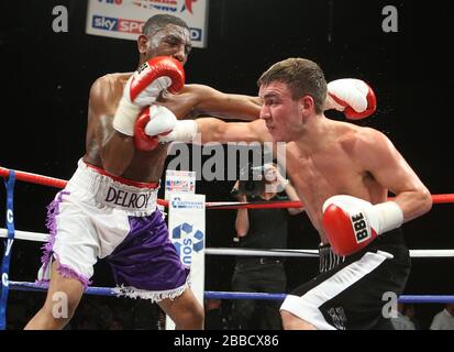 Lewis Pettitt (black shorts) defeats Delroy Spencer in a Super ...