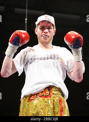 Joe Murray (gold shorts) defeats Yuri Voronin in a Super-Bantamweight ...