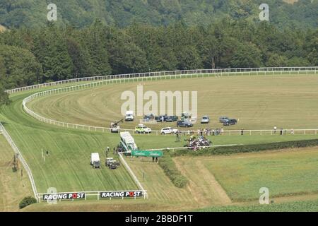 Runners and riders set off during the Copper Horse Stakes during day ...