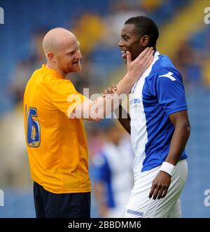 Oxford United's Andrew Whing (right) and Exeter City's Jimmy Keohane ...