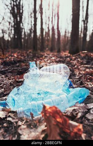 Plastic waste left in forest. Concept of plastic pollution and ...