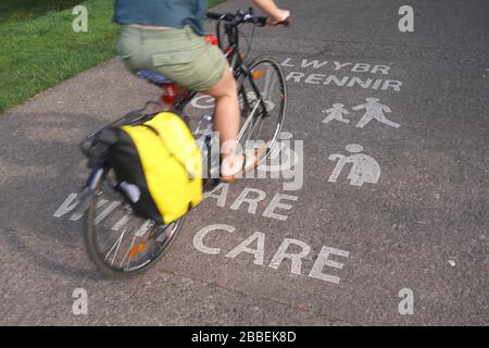 Share with care, bilingual English Welsh shared use path sign, cyclists ...