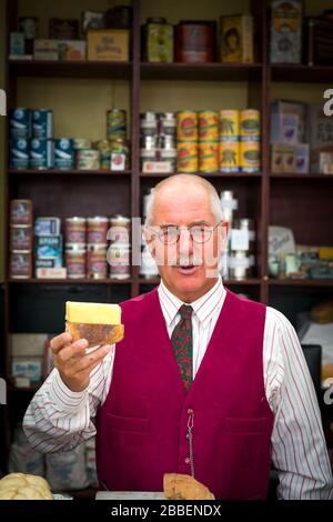Vintage grocer isolated in wartime grocery shop, 1940s WWII summer ...