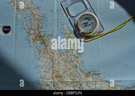 Map reading on a new zealand map with compass Stock Photo - Alamy
