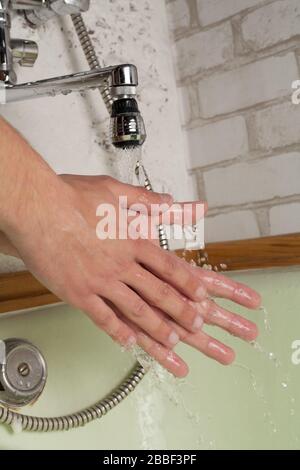 Hygiene and quarantined coronavirus prevention. Male hands close-up in ...