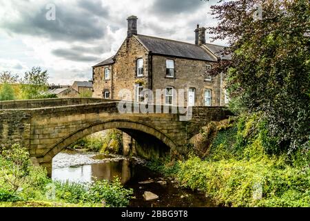 Village of Bellingham in Northumberland, UK with town hall and clock ...