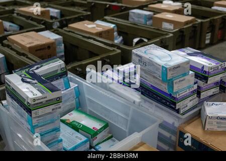 A U.S. Marine with 2d Marine Logistics Group (2D MLG) reads ...