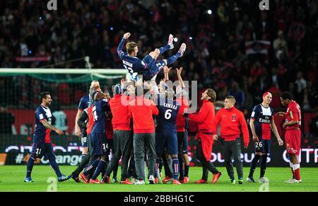 Paris Saint-Germain's throw David Beckham up into the air after the ...