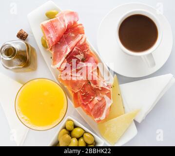 Delicious breakfast toast with hamon orange juice and olives Stock ...