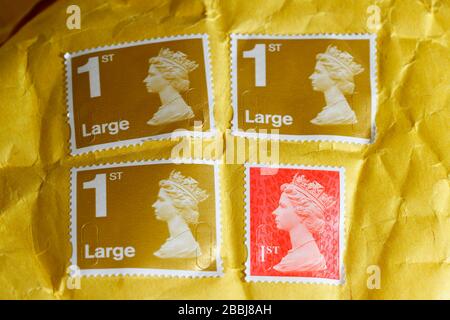 Stamps used to post a large parcel in the UK Stock Photo - Alamy