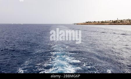 The seawater ship trail with a white foamy wave Stock Photo - Alamy