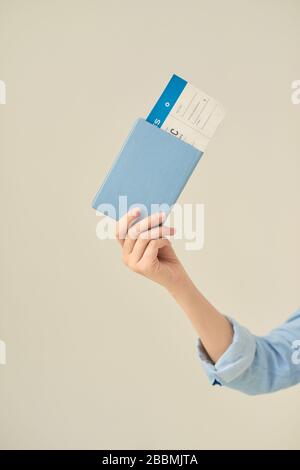 Close-up shot of a passport and a hand putting some stamps on it Stock ...