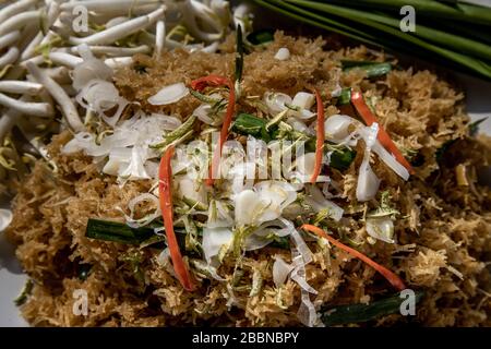Asian eating food, Mee Grob is an sweet and sour crispy noodles, made ...