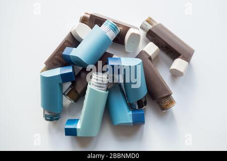 A blue salbutamol asthma reliever inhaler and two boxes, one opened ...